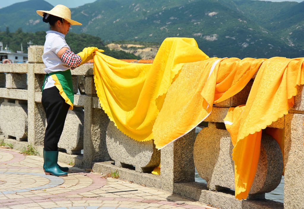 Woman Drying Tablecloths | The Taishan Project